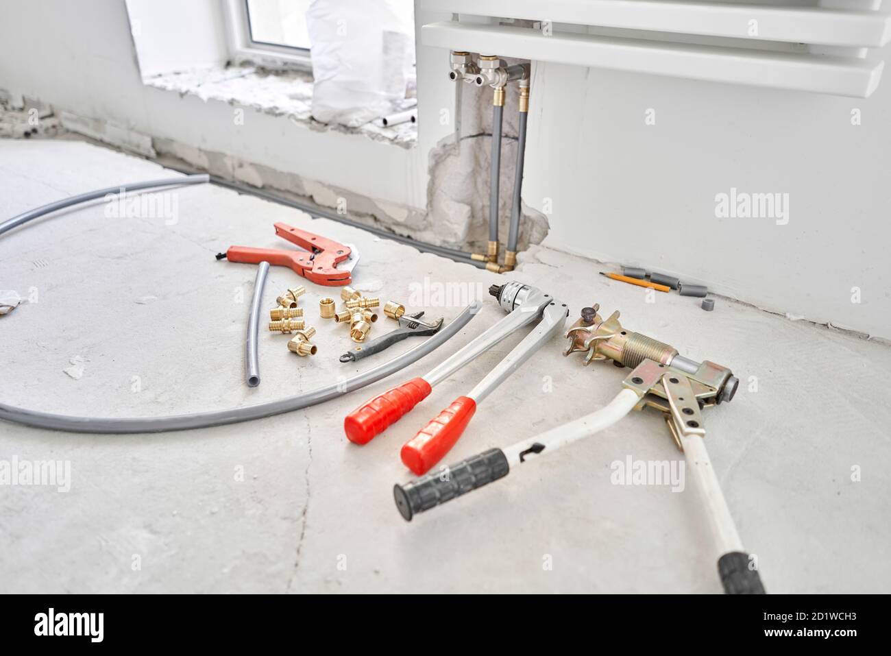 Tools for Work As A Plumber. Connection heating pipes to white Radiator ...