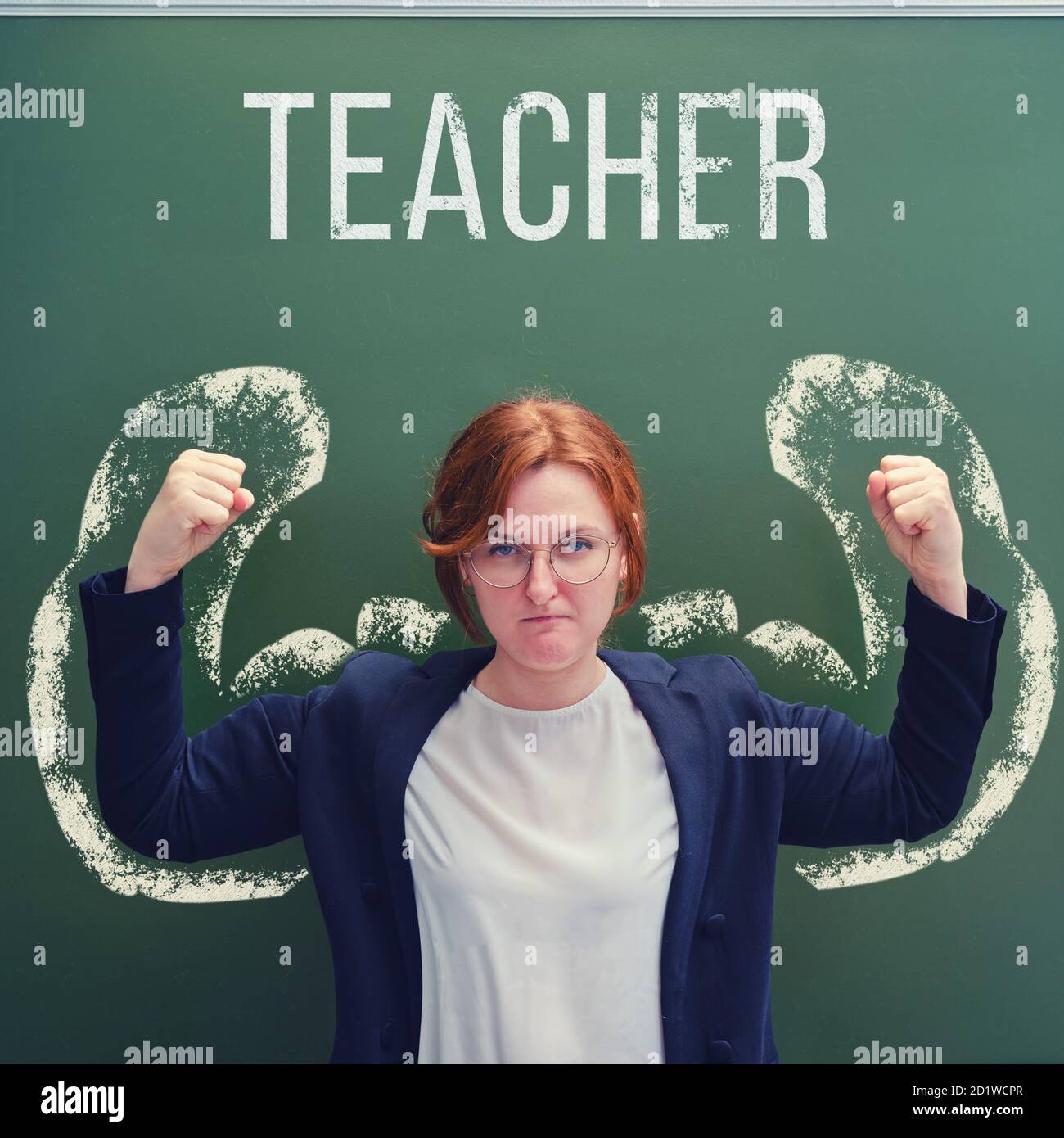 School teacher with chalked strong arms. Woman teacher shows the ...