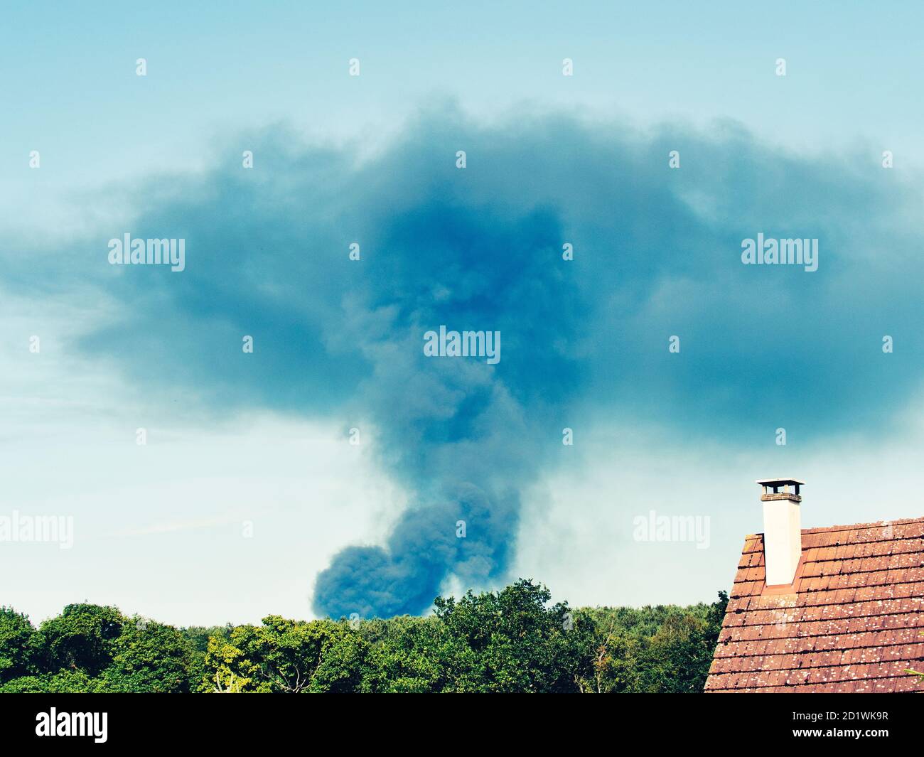 A Burning plastic recycling place causes a big pile of dark, black ...