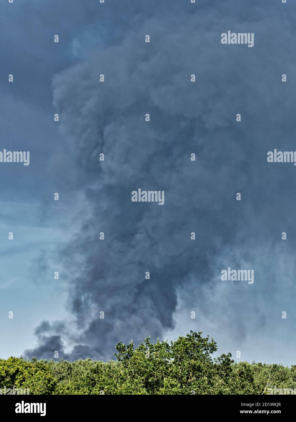 A Burning plastic recycling place causes a big pile of dark, black ...