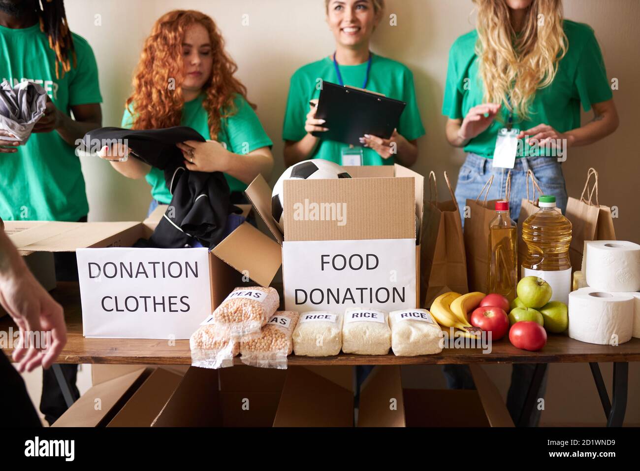 group of diverse people working in charitable foundation, happy ...