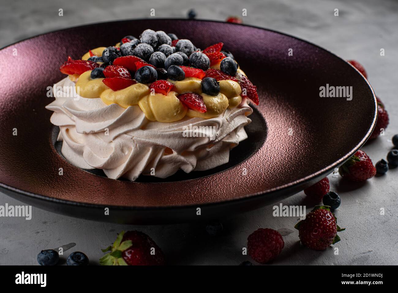 Beautiful Pavlova cake dessert with meringue and fresh fruit on white ...
