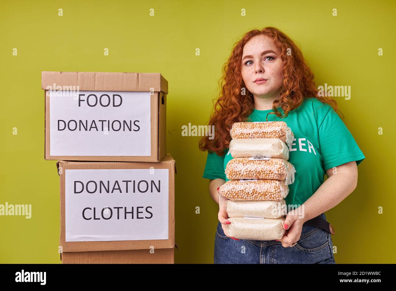 beautiful redhead volunteer woman collecting donation for poor, young ...