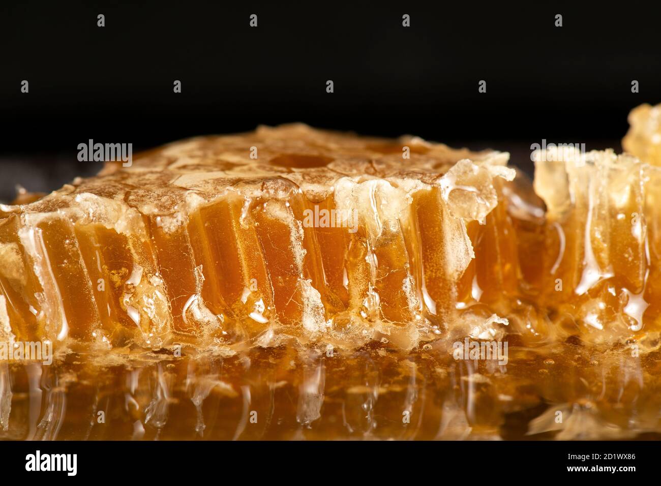 Detailed closeup macro photo of Beeswax and honey. Food background ...