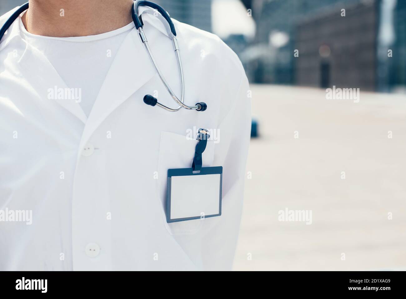close up. male paramedic with a badge on his white coat Stock Photo - Alamy