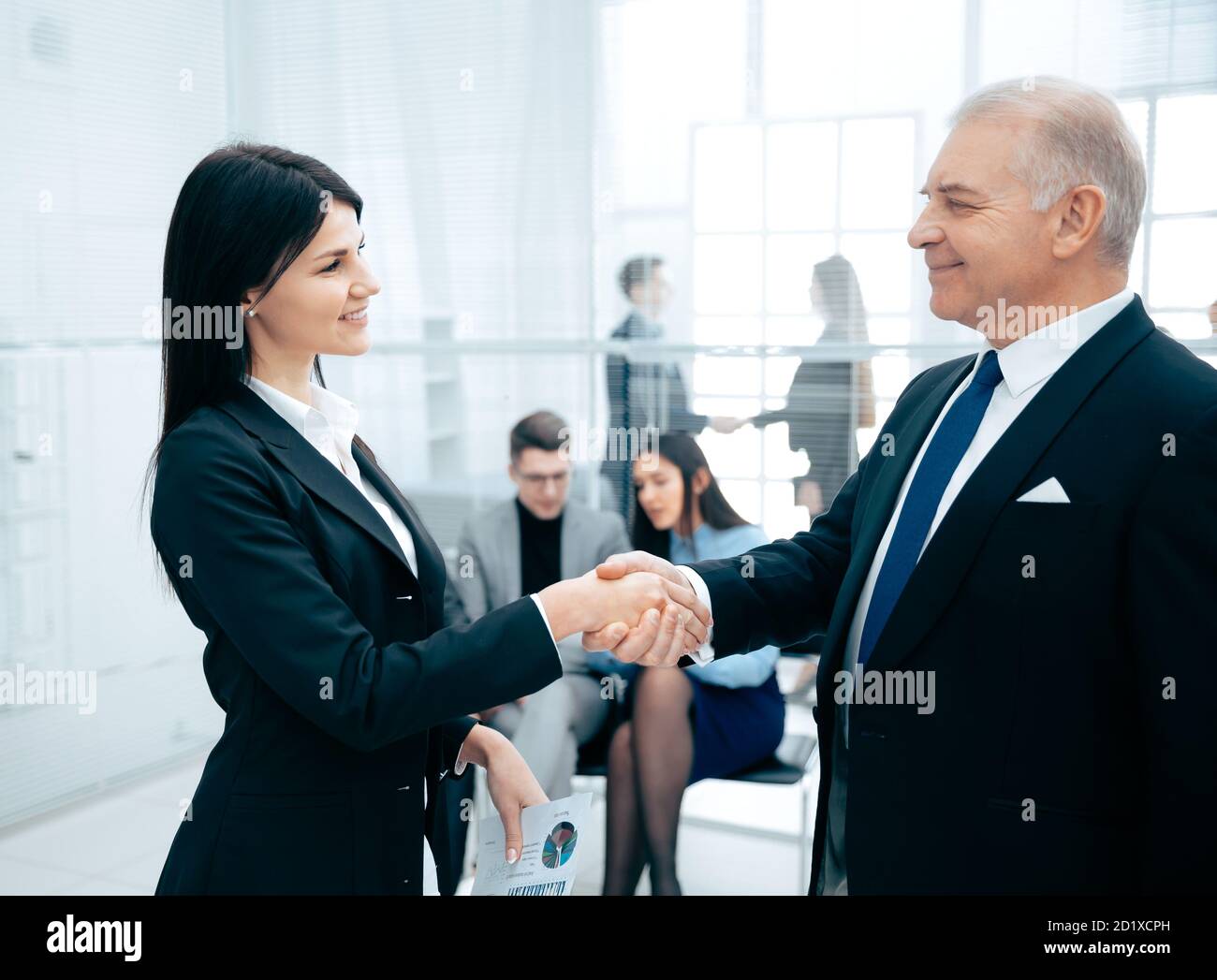 business partners greeting each other with a handshake Stock Photo - Alamy