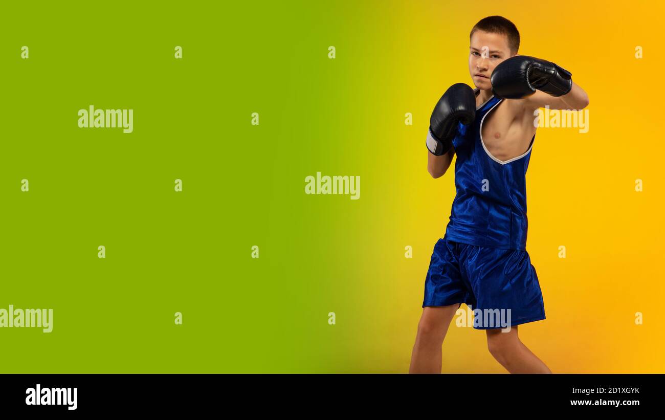 Champion. Teenage professional boxer training in action, motion ...