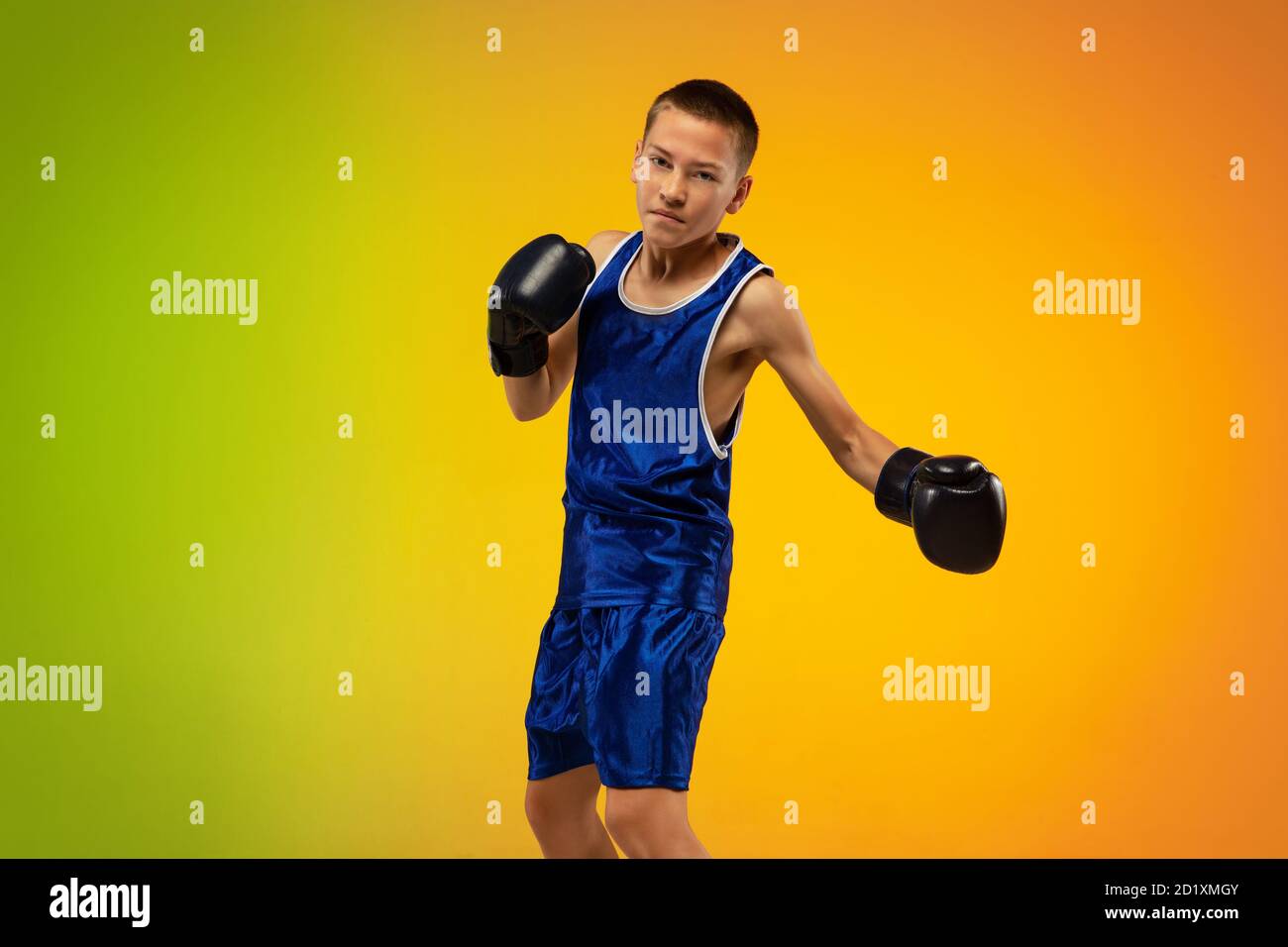 Youth. Teenage professional boxer training in action, motion isolated ...