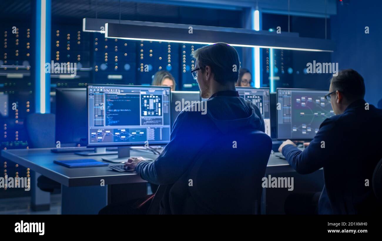 Team of IT Programers Working on Desktop Computers in Data Center ...