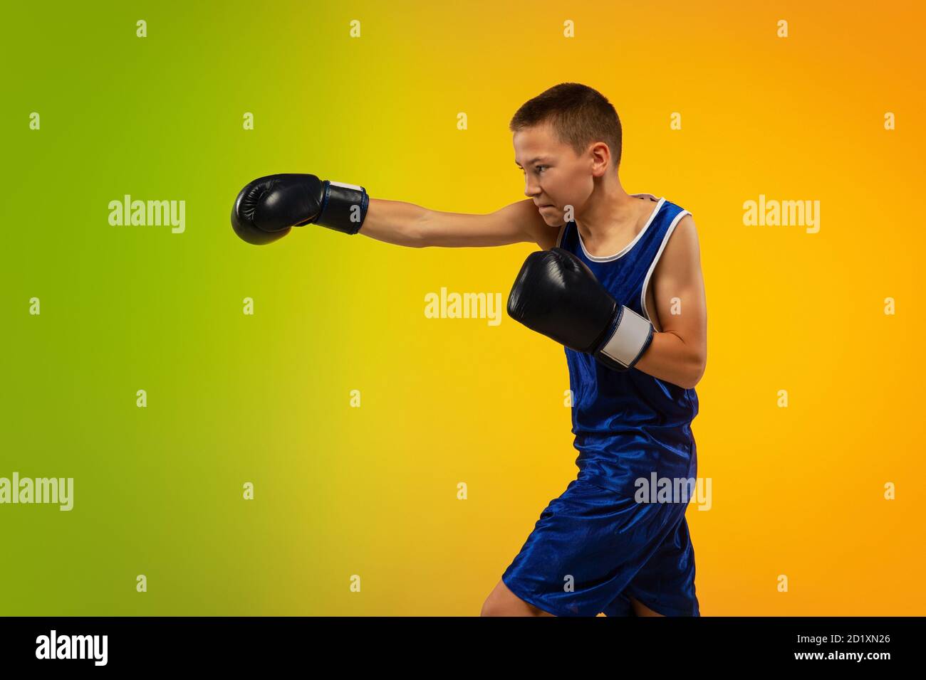 Youth. Teenage professional boxer training in action, motion isolated ...