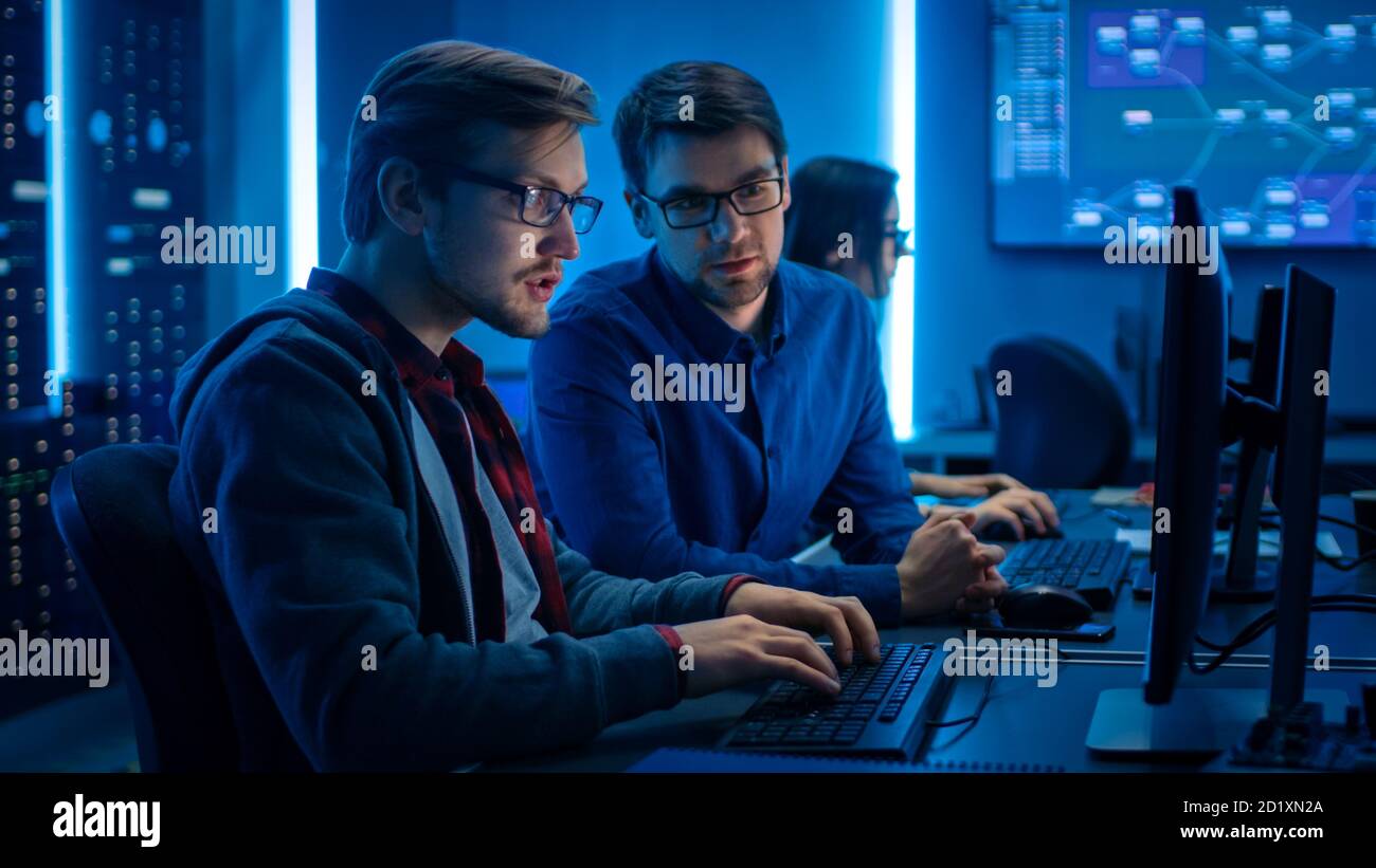 Two Professional IT Programers Discussing Technical Data Show on ...