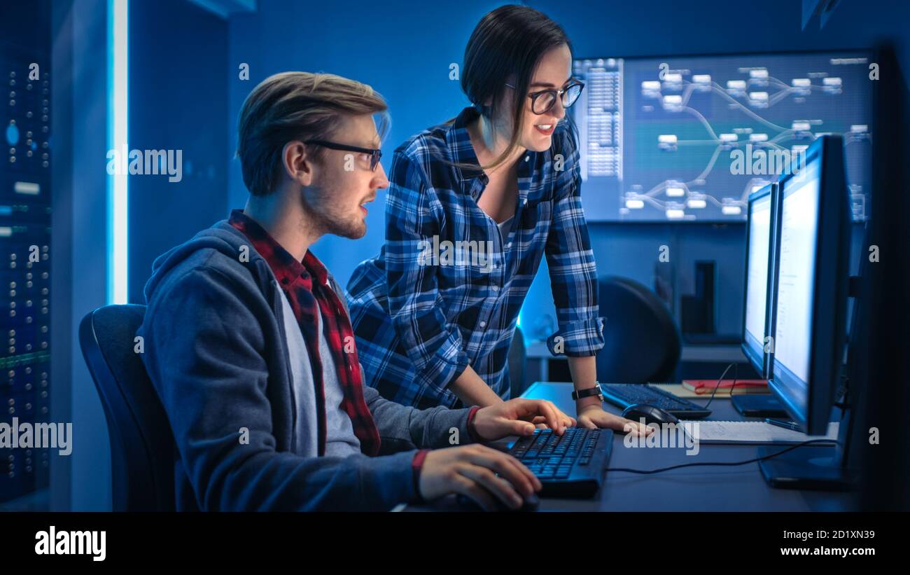 Male and Female Programmers Talking, Solving Problem, Using Computers, Doing High Five After ...