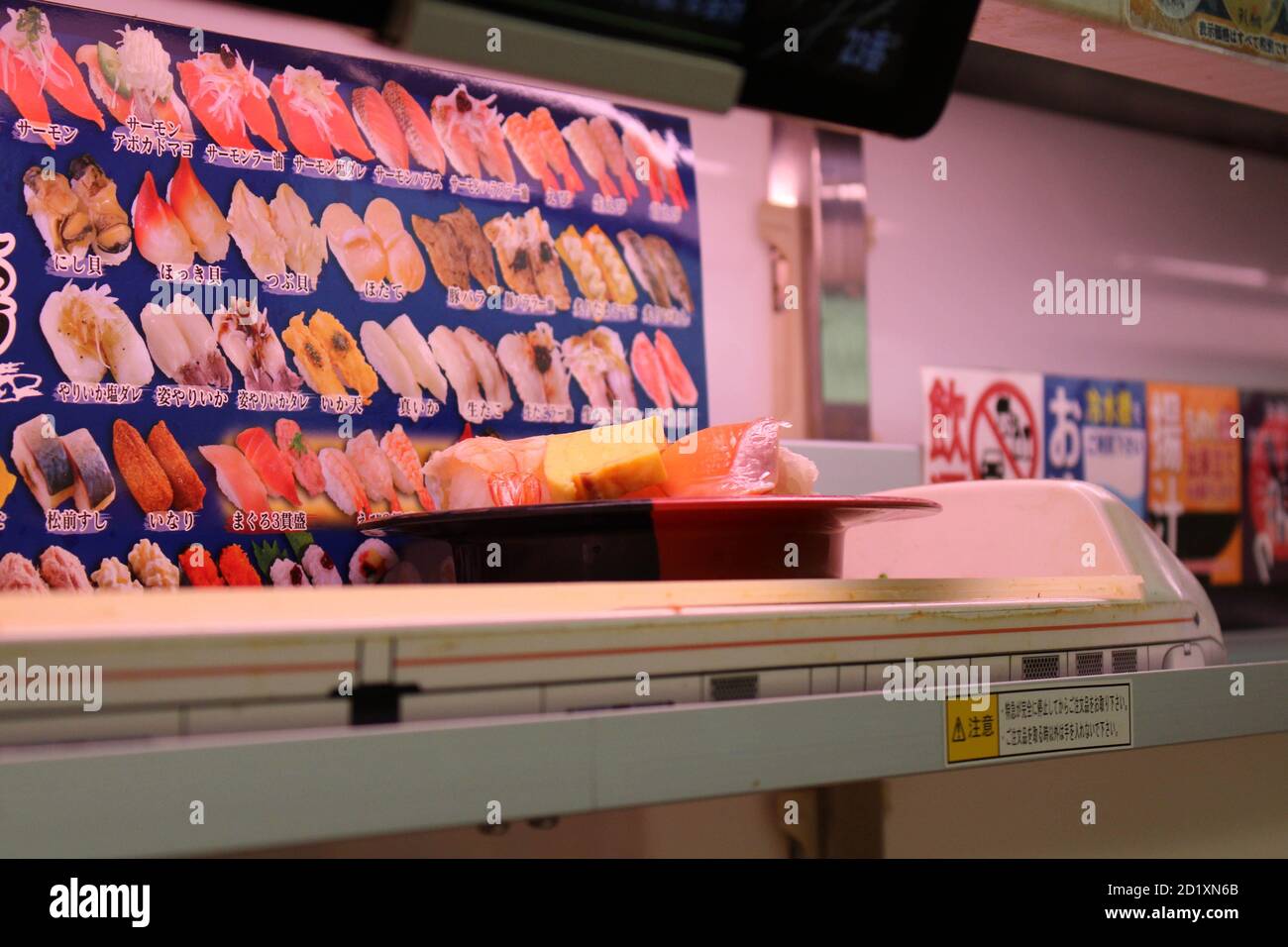 Sushi train serving food at one sushi shop in Nobeoka, Miyazaki, Japan ...