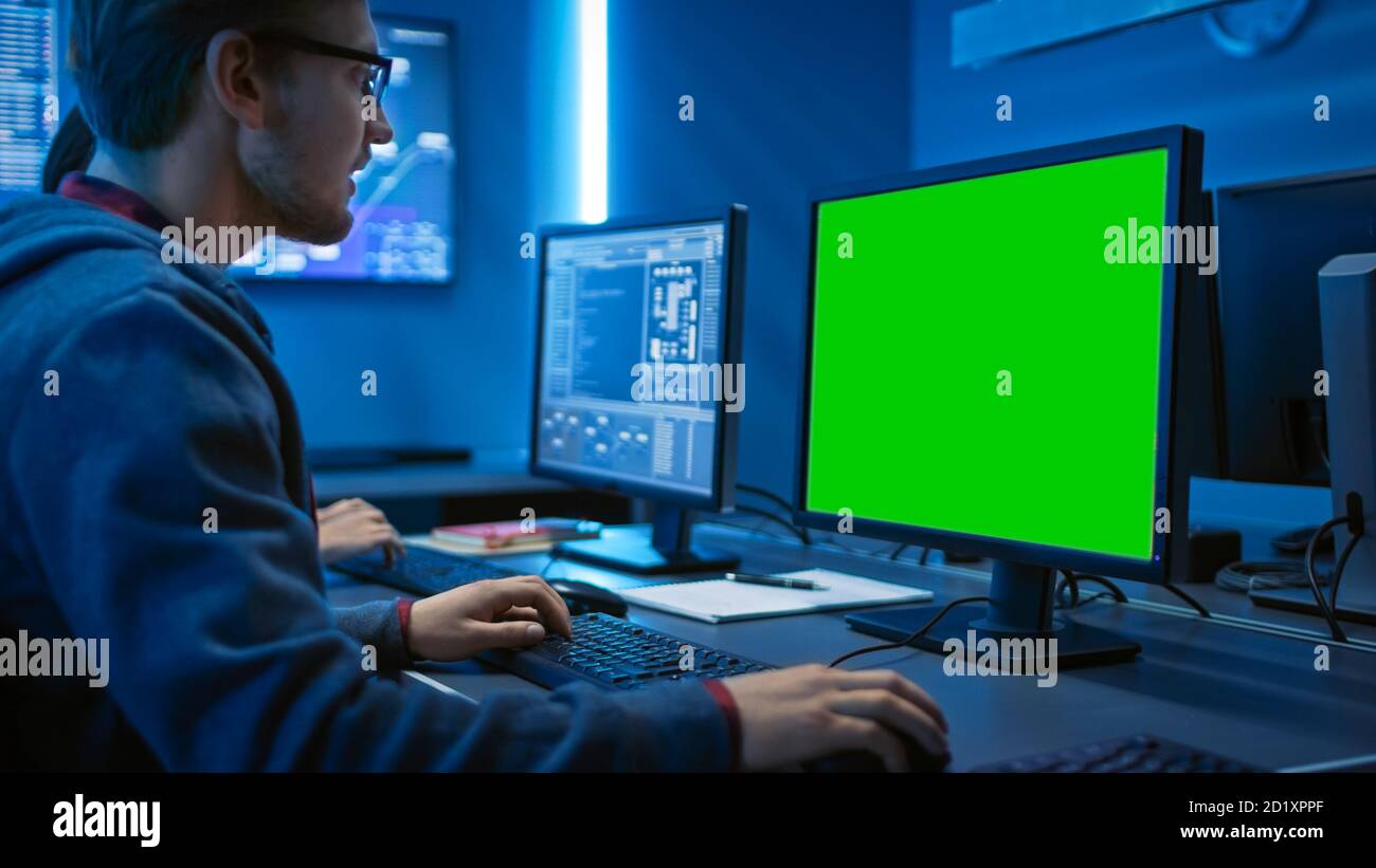 Smart Male It Programer Working On Desktop Green Mock Up Screen Computer Software Development