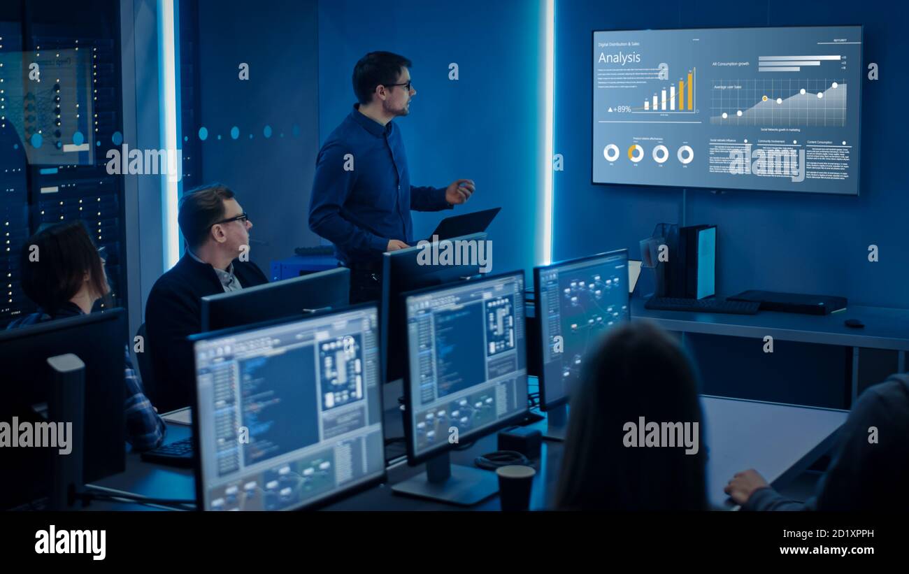 Team of Professional IT Developers Have a Meeting, Speaker Shows Growth ...