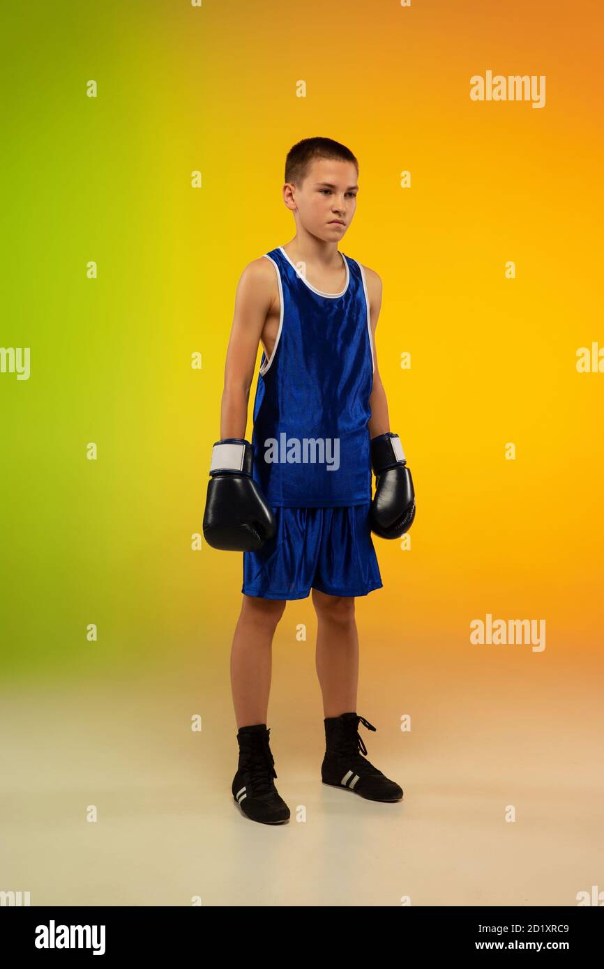 Fighter. Teenage professional boxer training in action, motion isolated ...