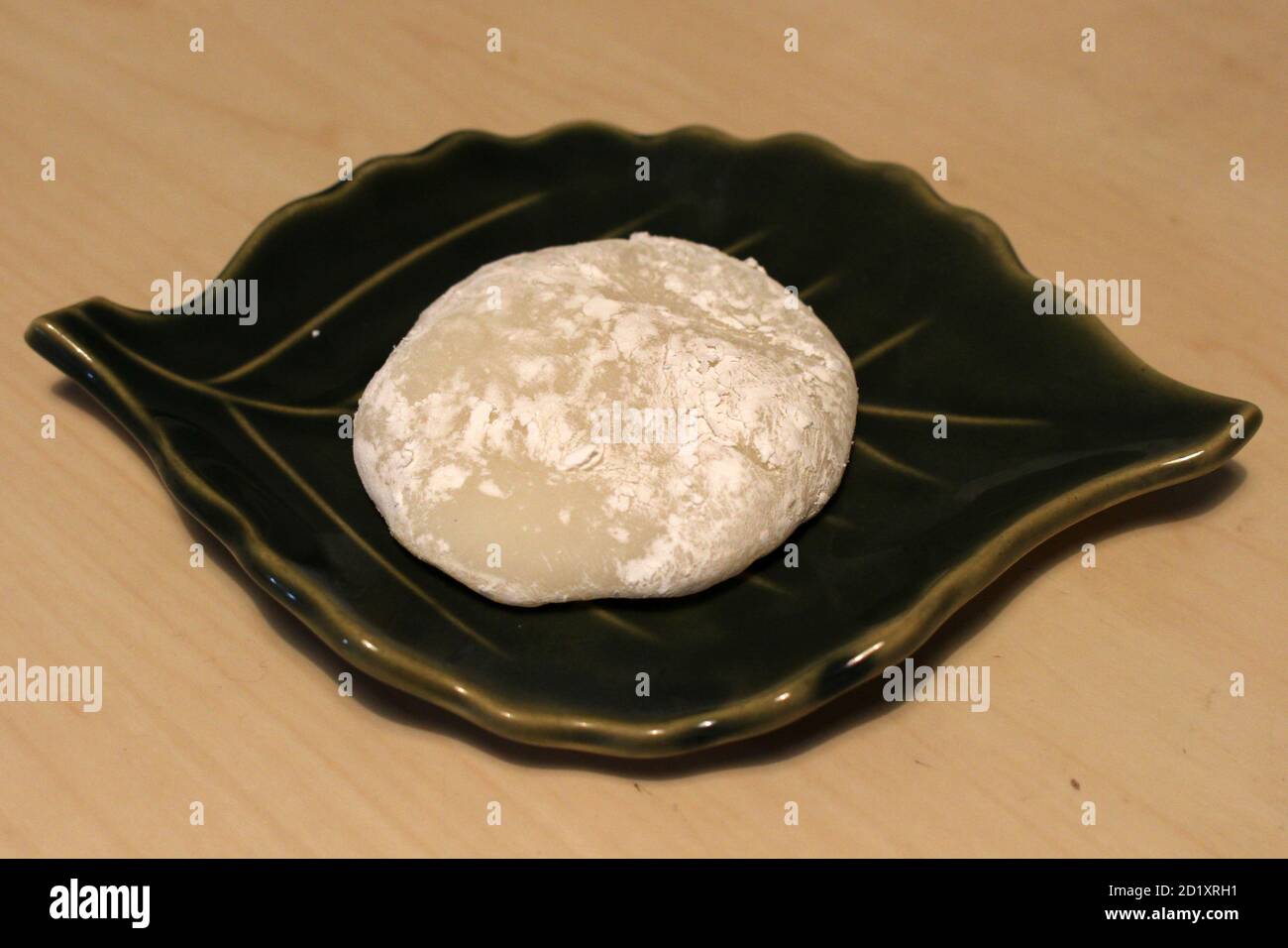 Plate serving a single bun of Japanese plain mochi Stock Photo - Alamy