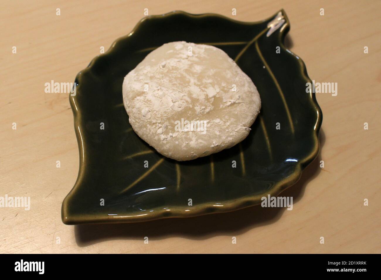 Plate serving a single bun of Japanese plain mochi Stock Photo - Alamy