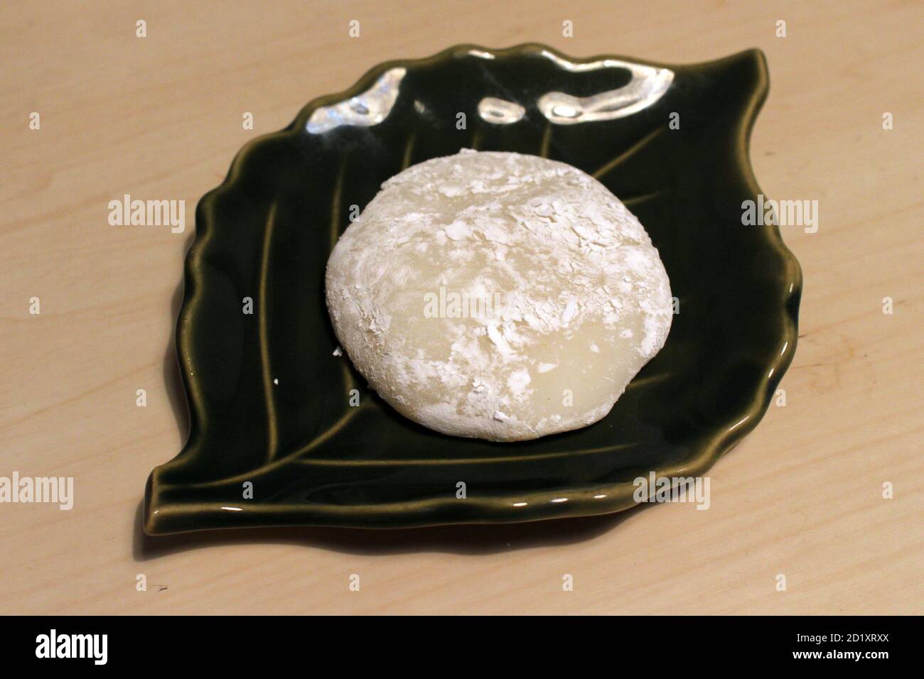 Plate serving a single bun of Japanese plain mochi Stock Photo - Alamy