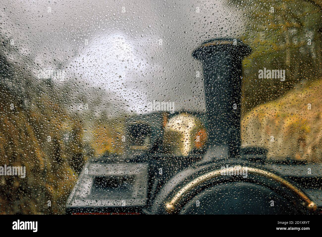 A steam engine seen through a rain covered window Stock Photo - Alamy