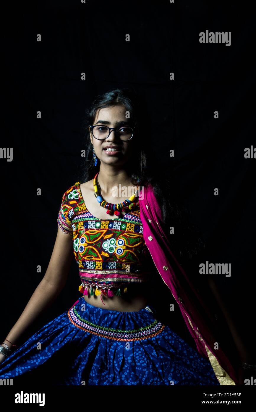 Indian girl in traditional chaniya choli for navratri with a ...