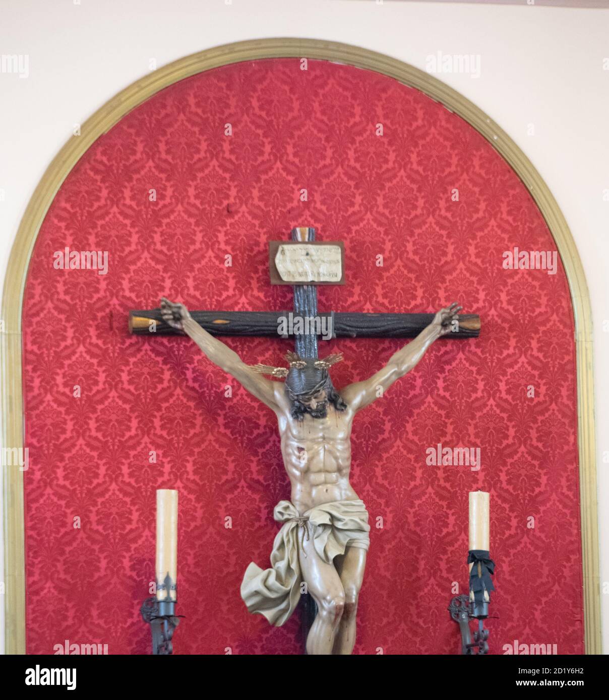 Figure of Jesus Christ on a cross on the wall of a church Stock Photo ...