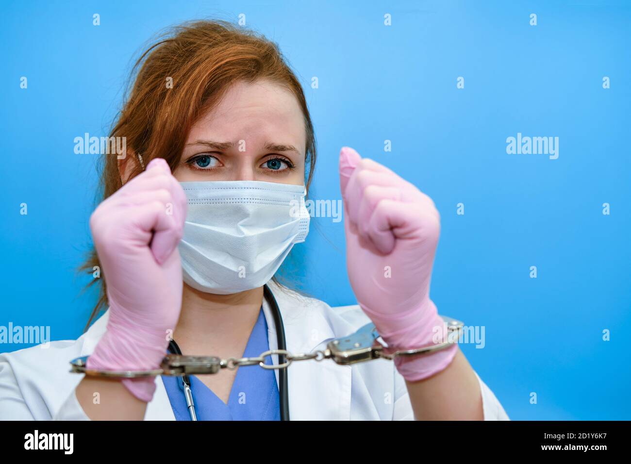Female hands tied handcuffs hi-res stock photography and images - Alamy