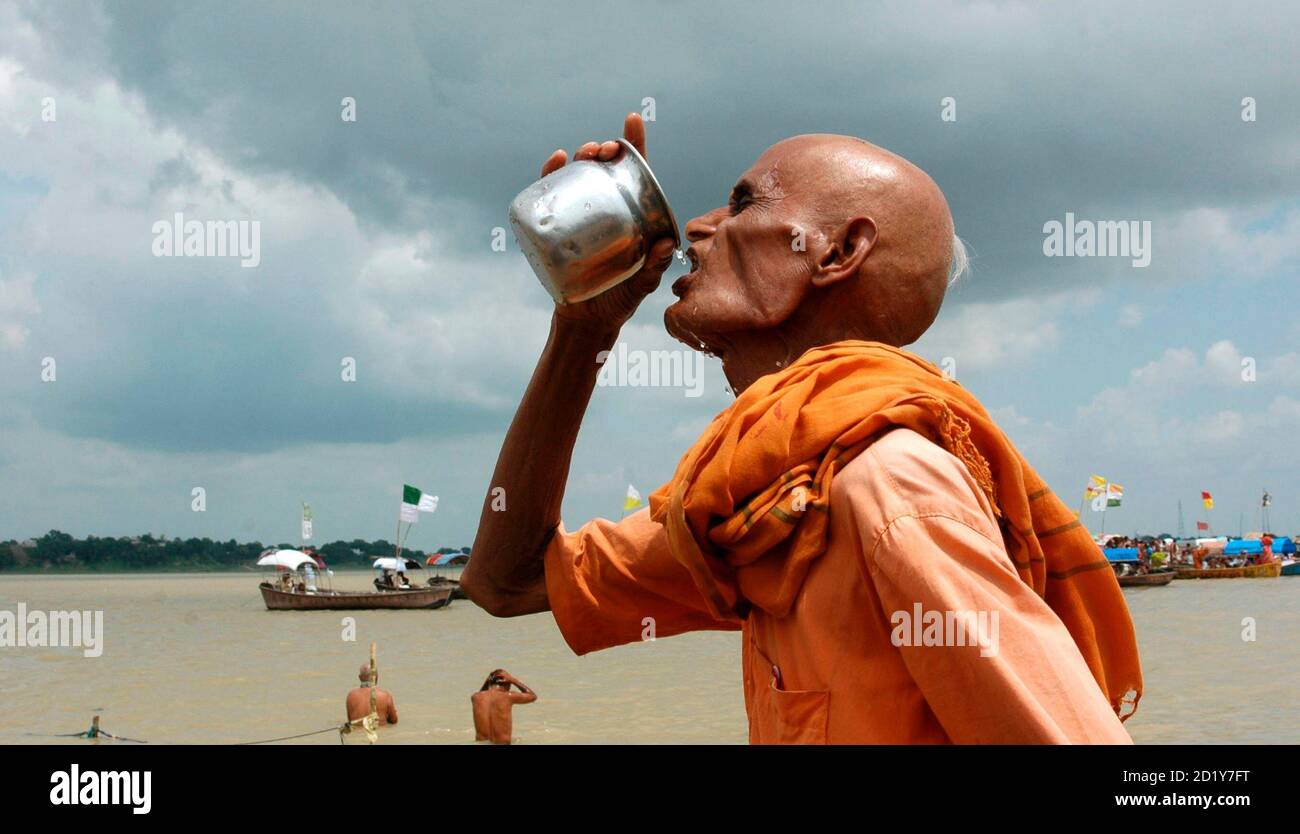 Man drinking holy water river hi-res stock photography and images - Alamy
