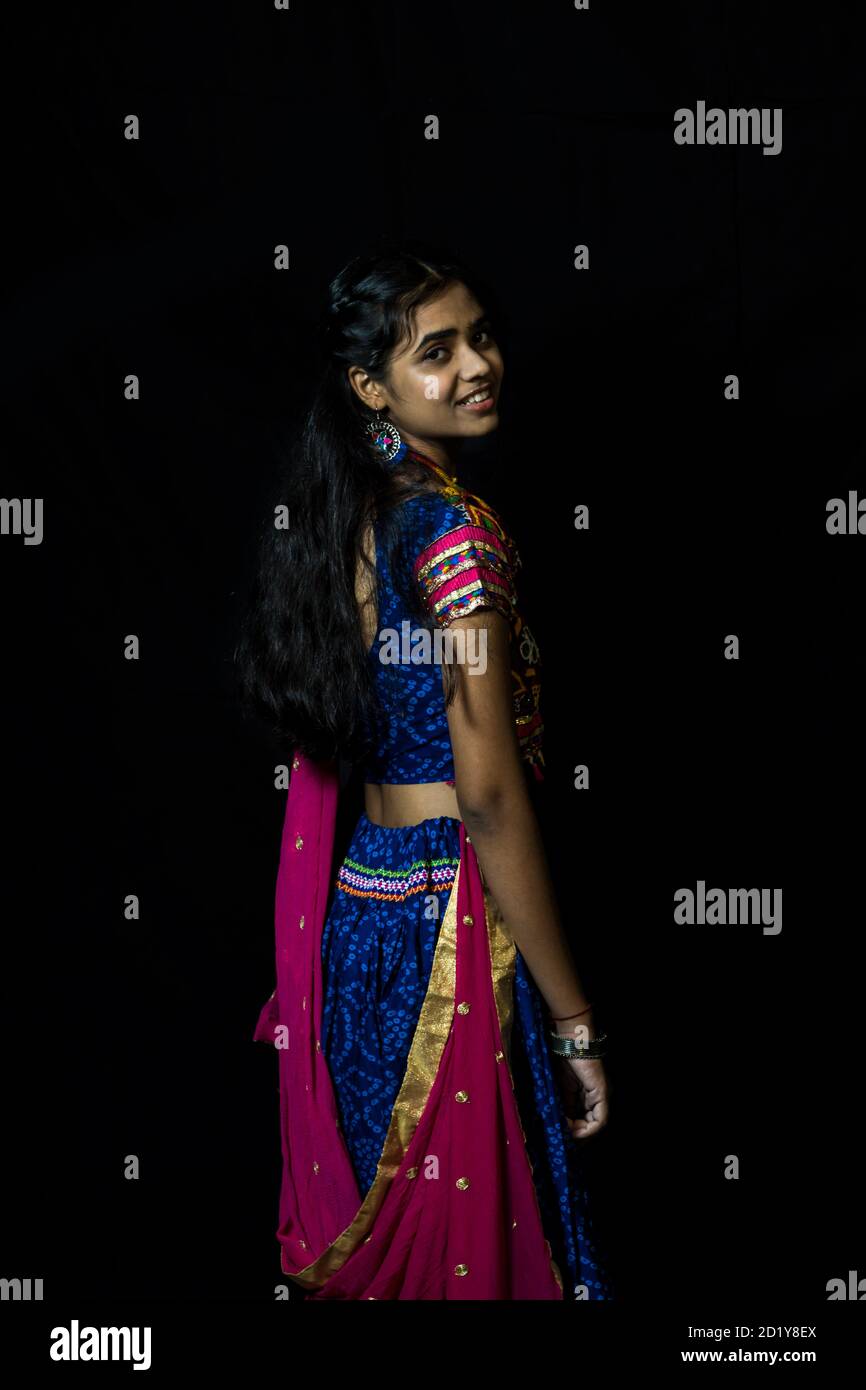 Indian girl in traditional chaniya choli for navratri with a ...