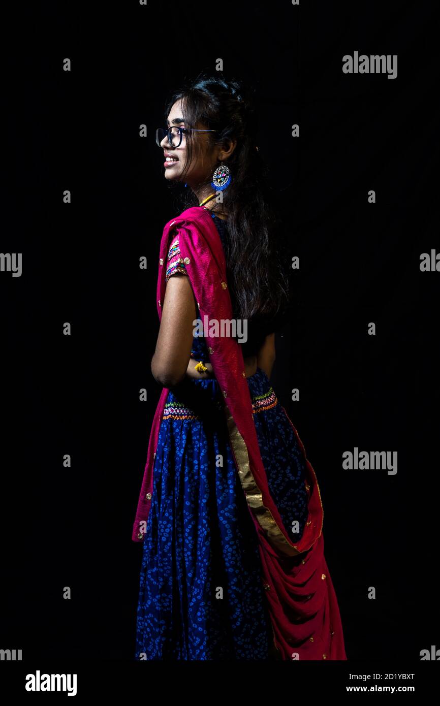 Indian girl in traditional chaniya choli for navratri with a ...