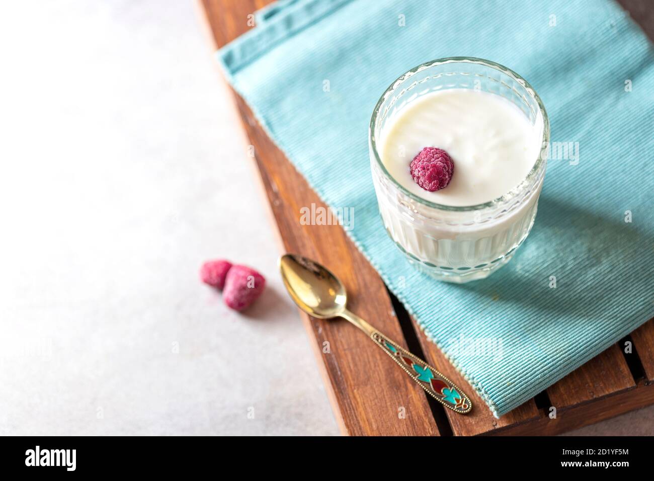 Fermented drink kefir in a glass jar on a light background. Probiotic ...