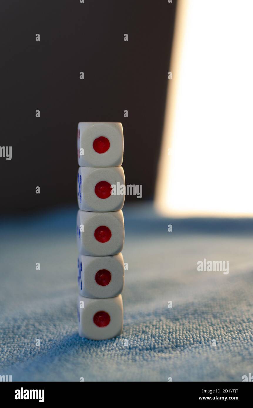Vertical closeup shot of tower of five dice number one Stock Photo - Alamy