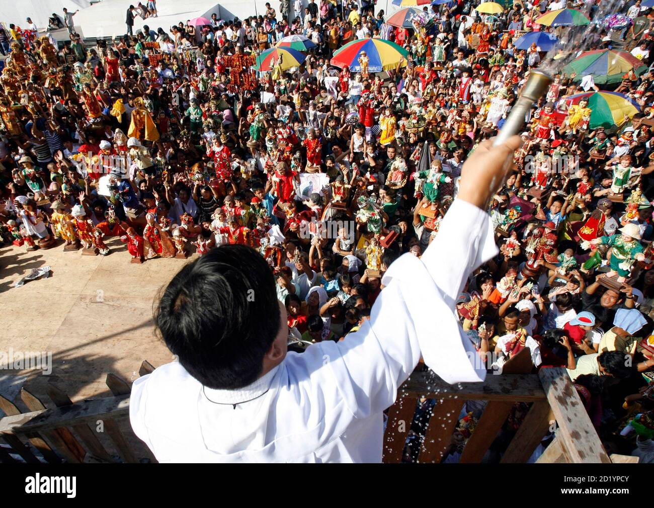 Catholic priest sprinkles holy water hi-res stock photography and ...
