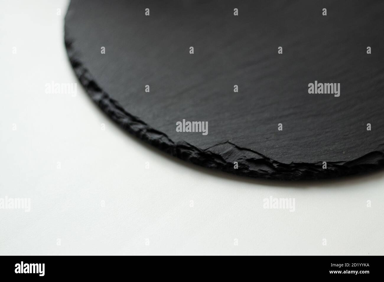 round black slate board on white background Stock Photo - Alamy
