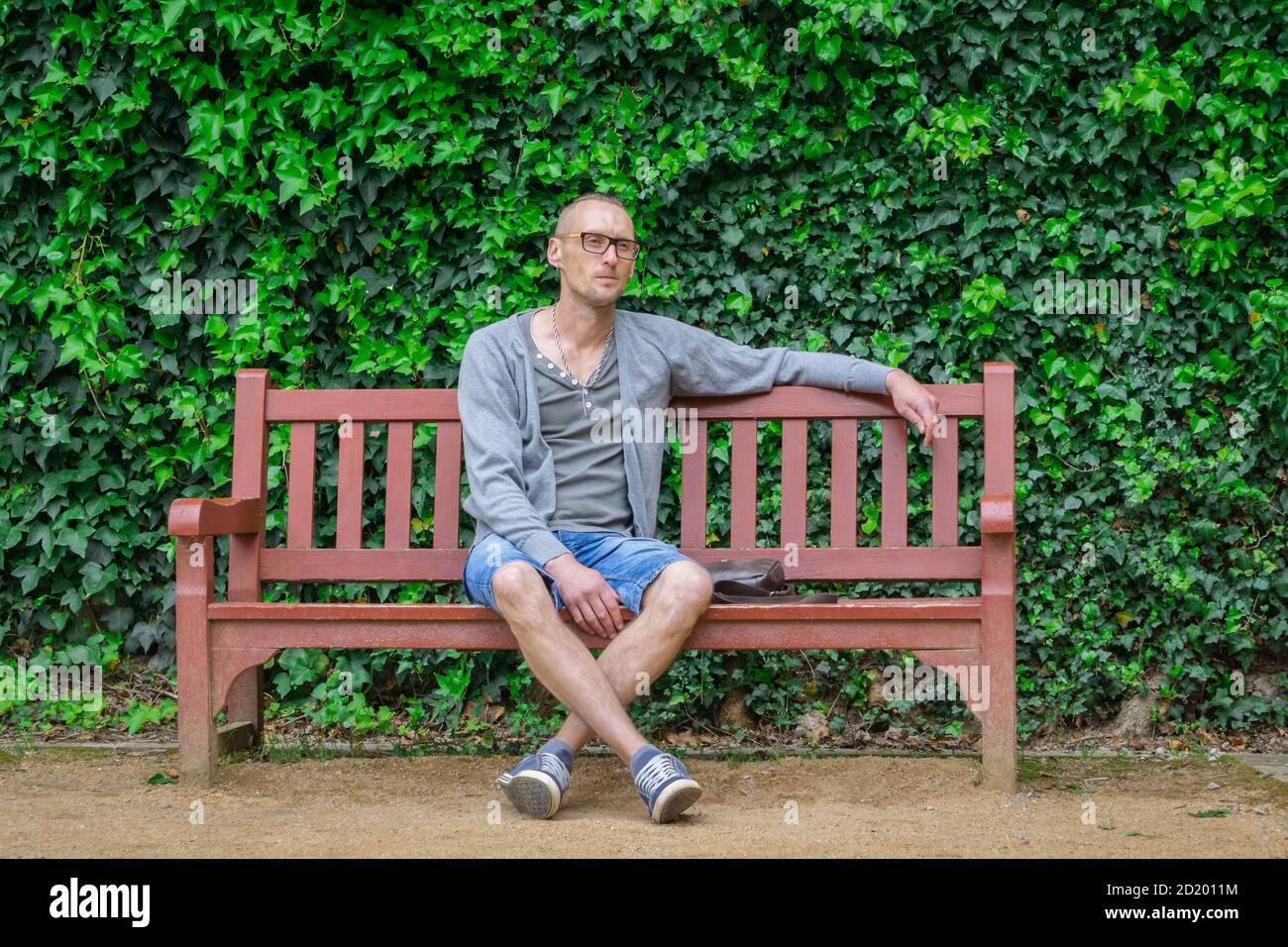 Lonely man sitting alone on bench and thinking. Loneliness concept ...