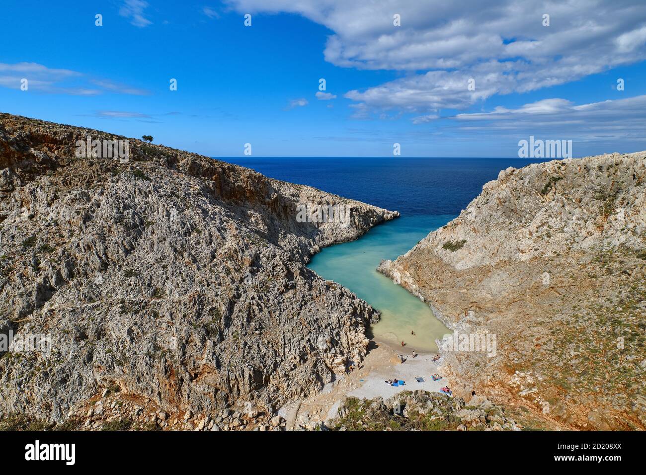 View of z-shaped bay, Crete landscape. Clear blue sky, great clouds ...
