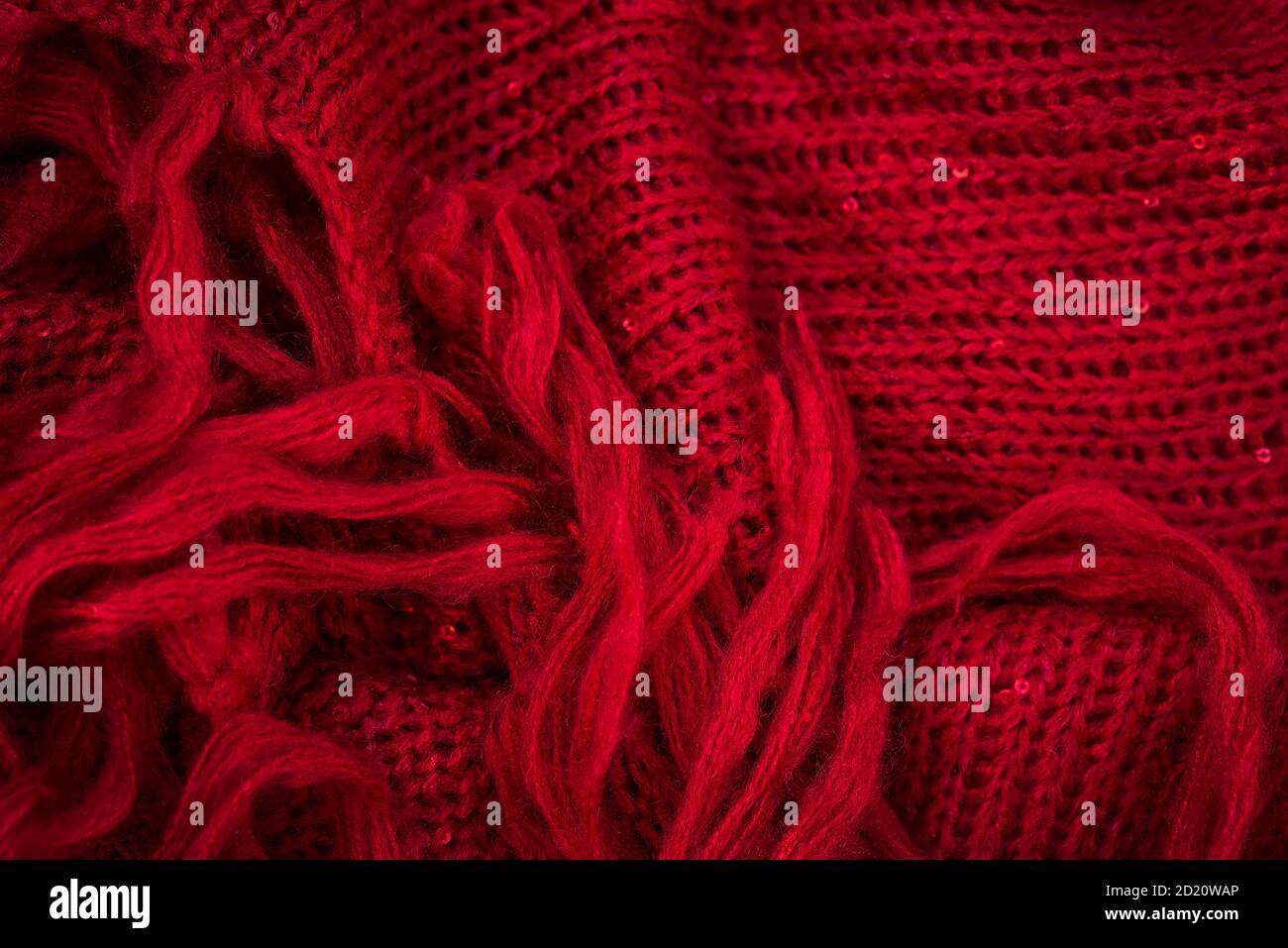 Red woollen jumper / shawl covered with tassels. Winter / Autumn / Fall ...