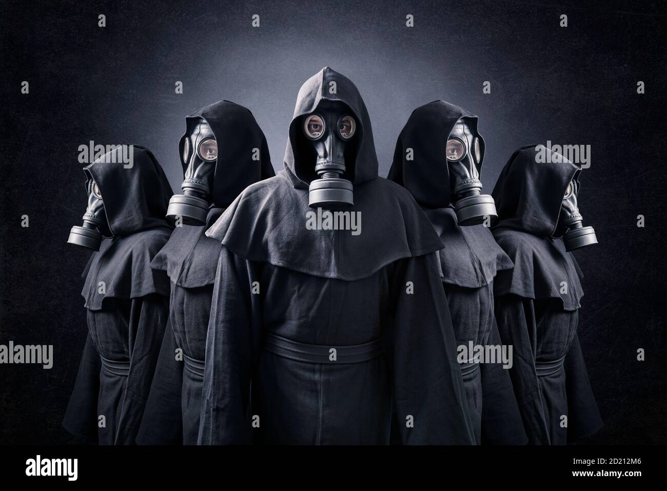 Group of five scary figures with gas masks and hooded cloaks in the ...
