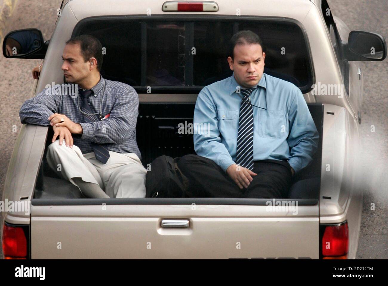 Workers riding in back of truck hi-res stock photography and images - Alamy