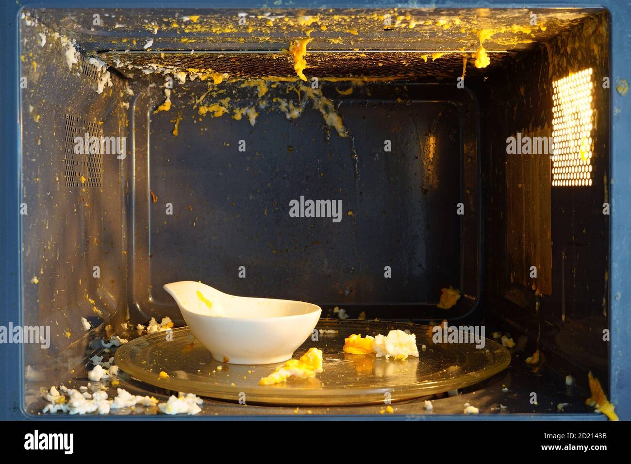Egg exploded in the microwave. Wrong egg cooking in the microwave Stock ...