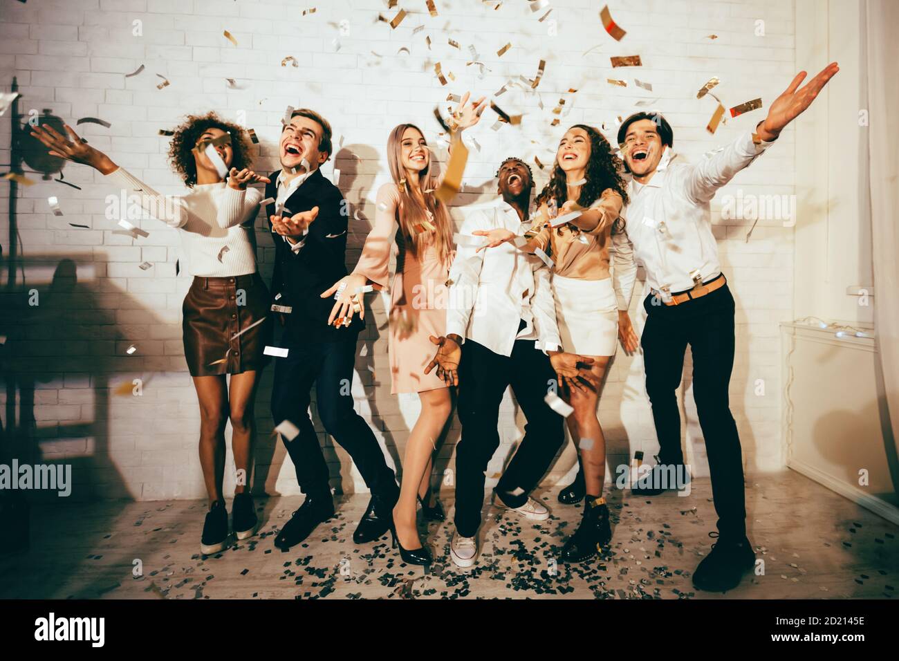 Happy Millennials Celebrating Having Fun Standing Under Falling ...