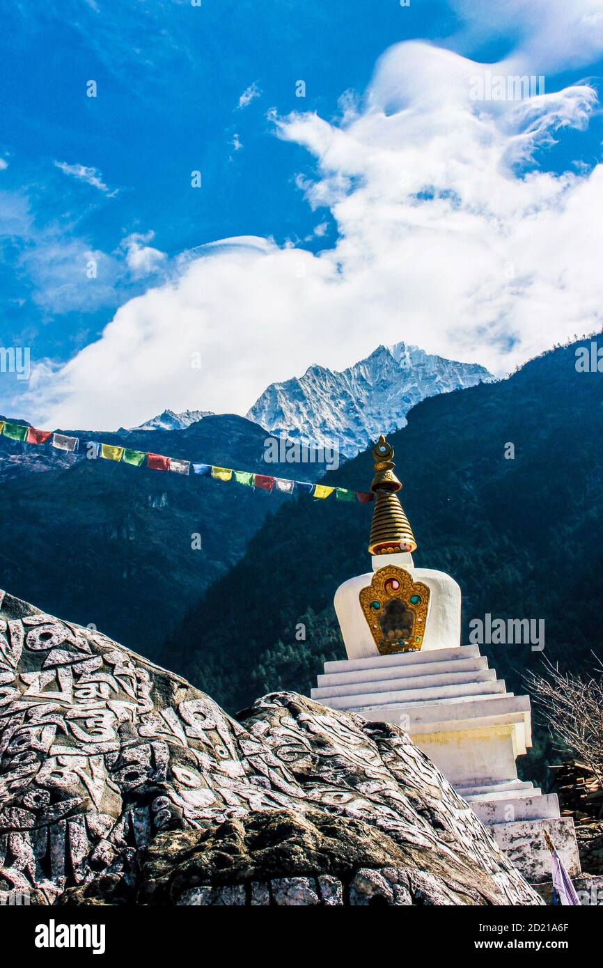 Himalayan landscape with stupa, prayer flags and mani stone Stock Photo ...