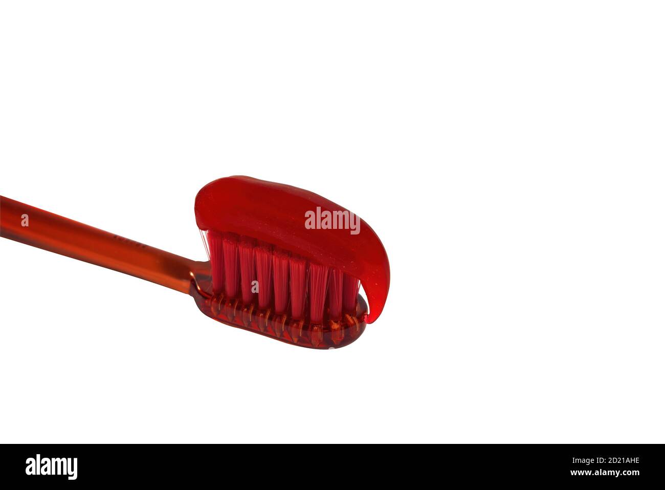 Red toothbrush with red toothpaste isolate on a white background close ...