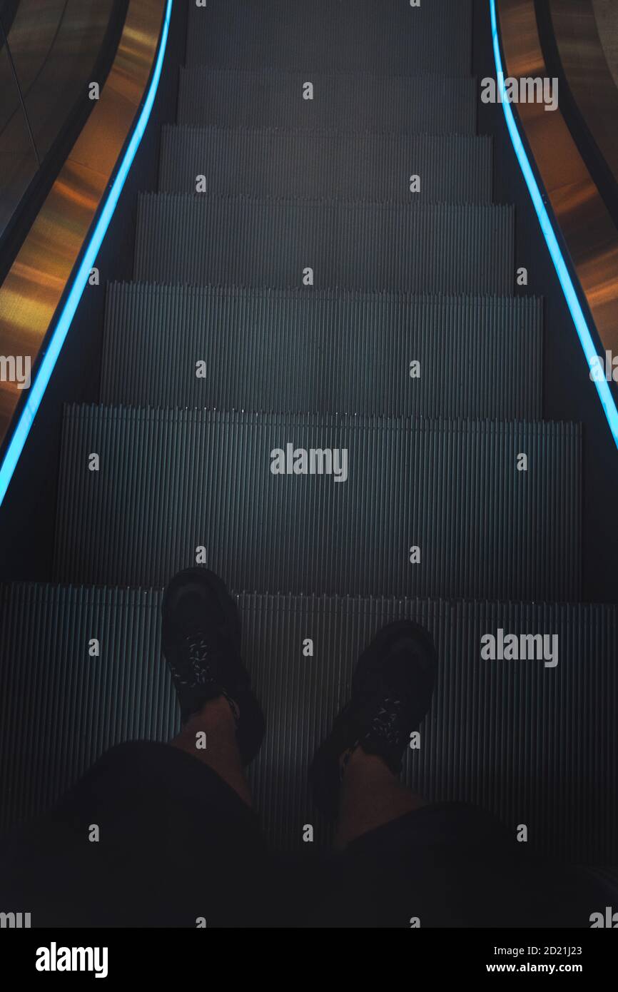 Shoes on escalator hi-res stock photography and images - Alamy