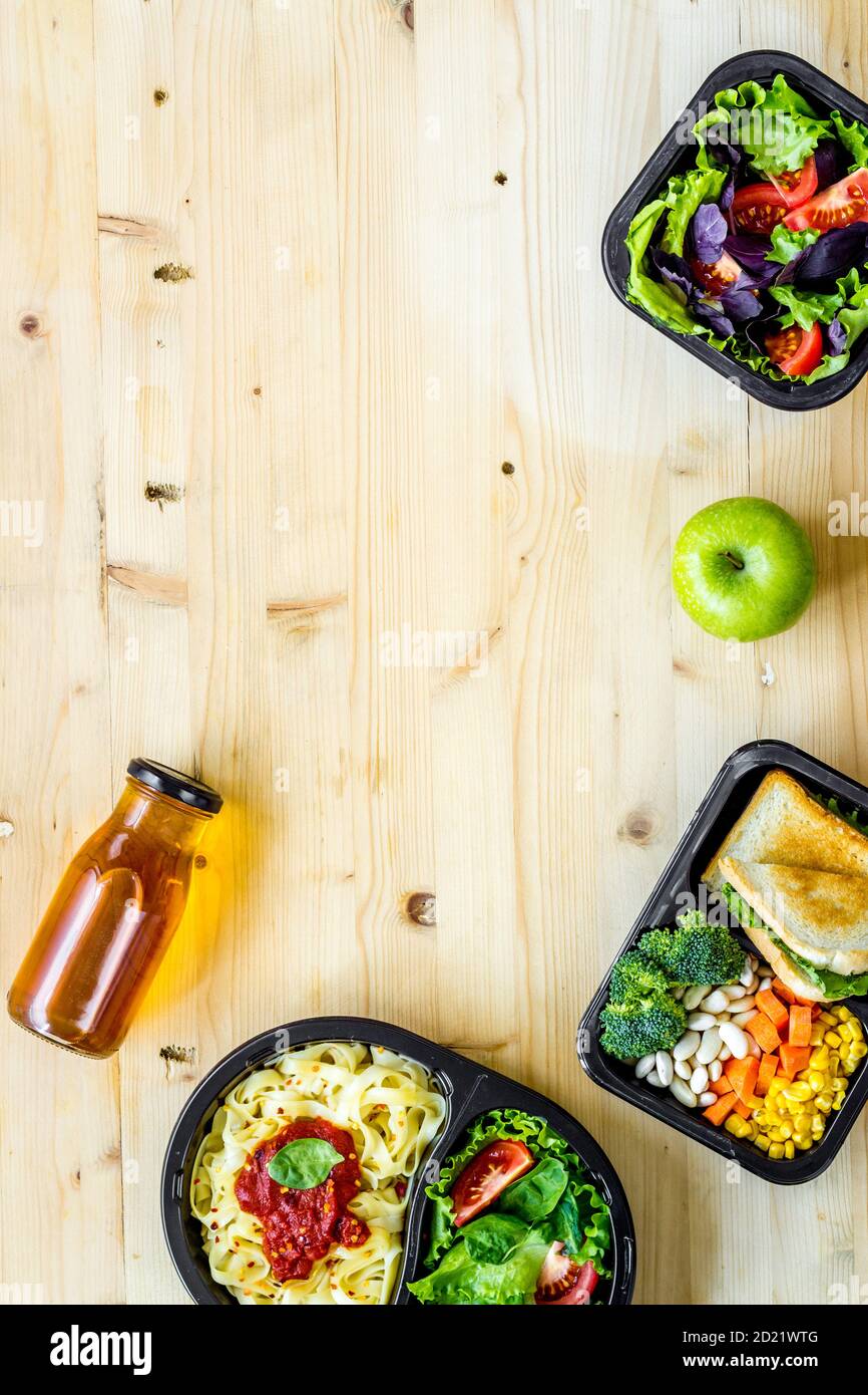 Lunch boxes with meal. Food delivery concept. Overhead view Stock Photo ...