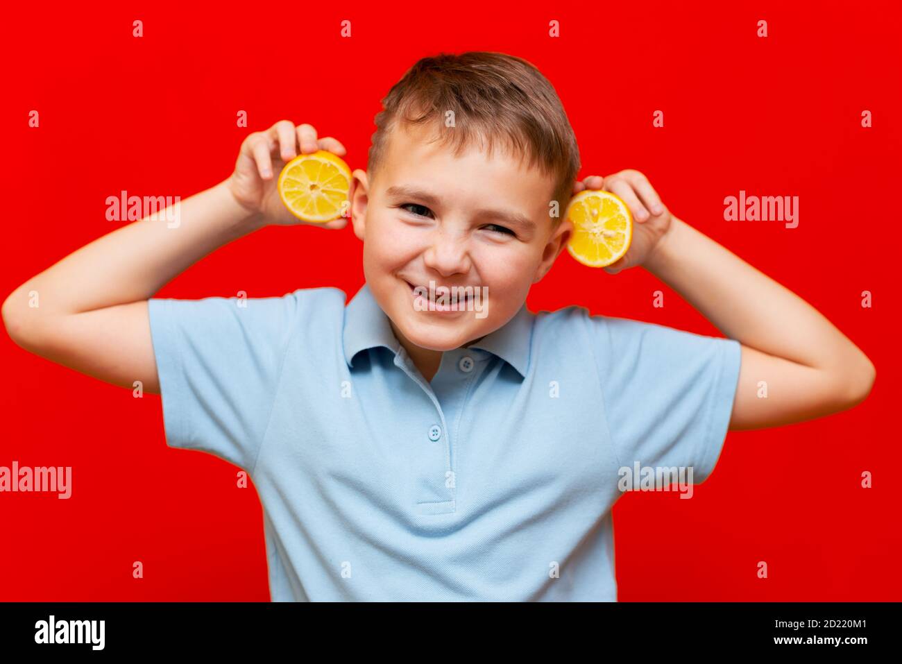Healthy lifestyle people. Funny smiling image of school boy showing two ...
