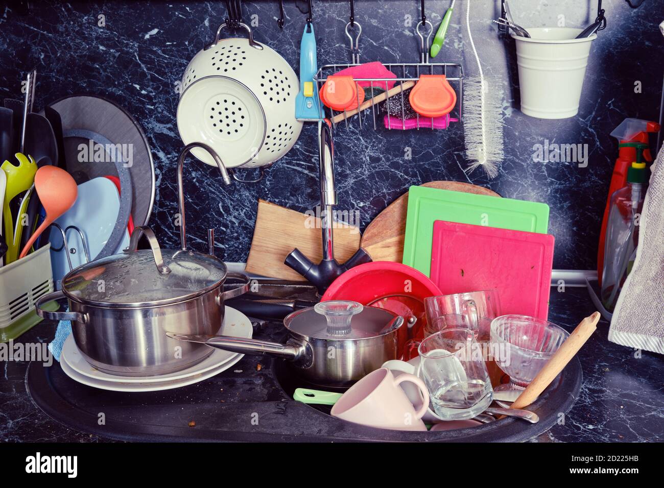 Cooking utensils after cooking and feast dumped not washed in the sink ...