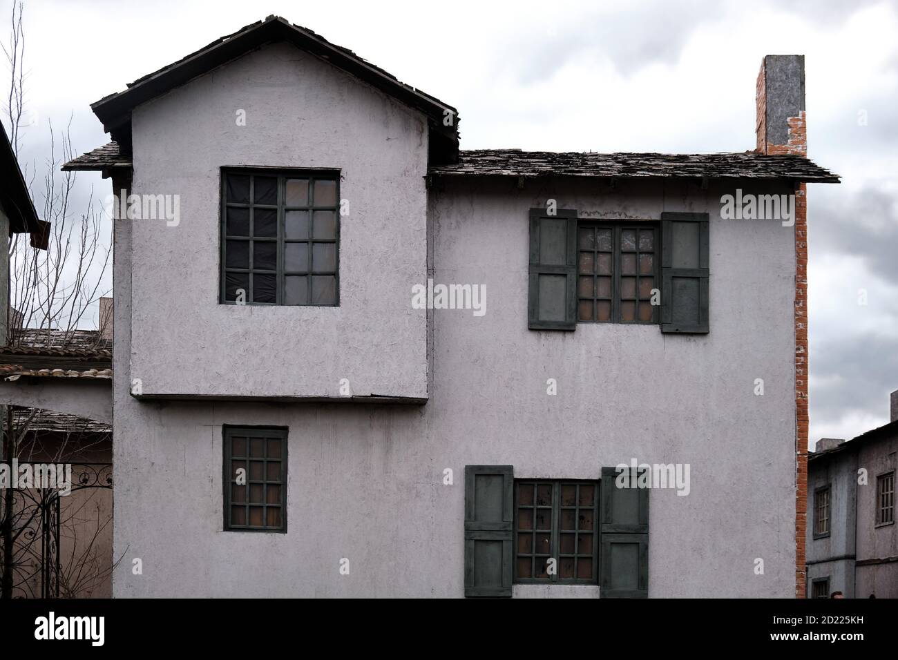 Ancient house in european medieval style on a background of gray cloudy ...