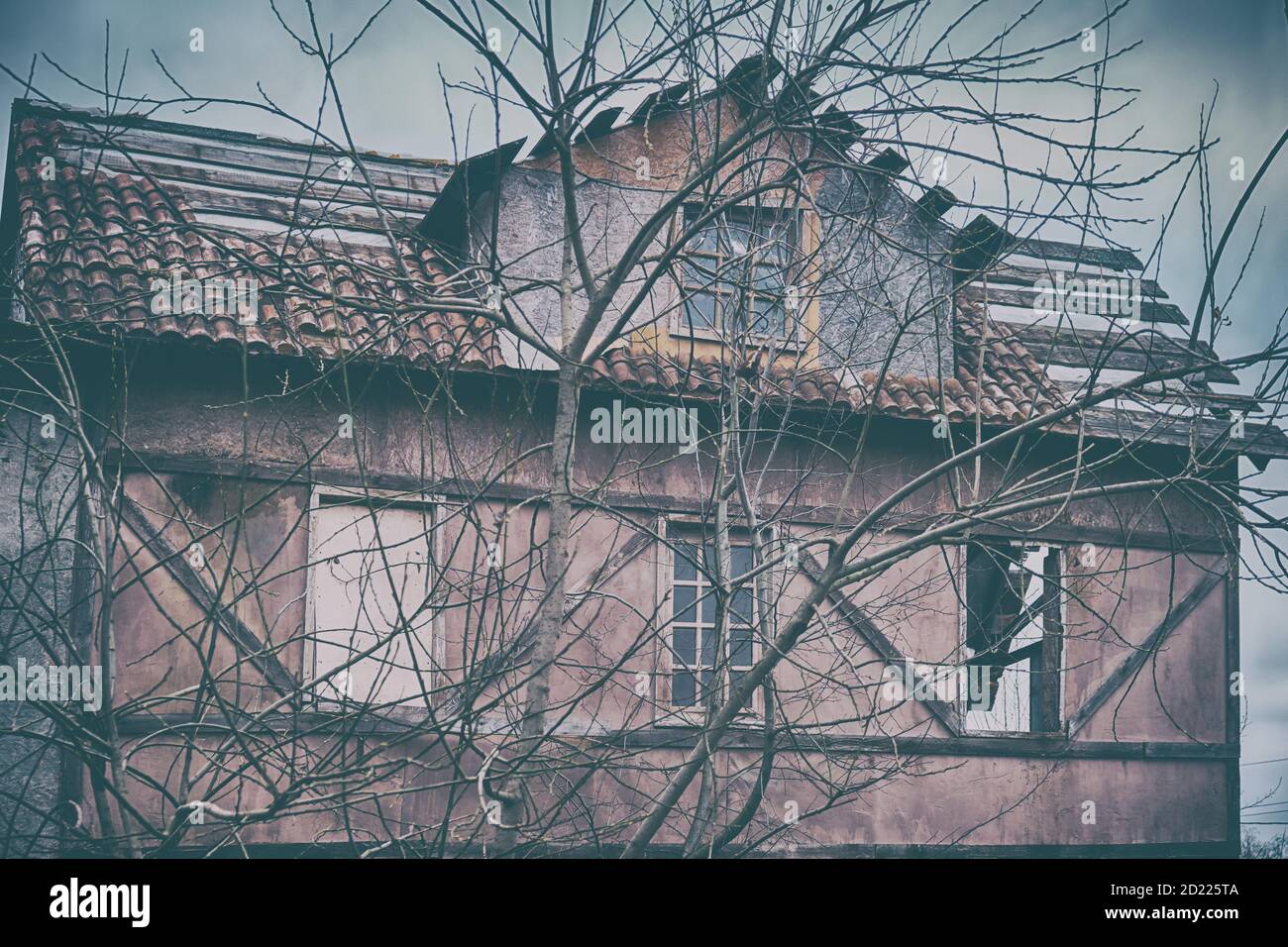 An old building with broken windows and a ruined roof. Ancient ruined ...