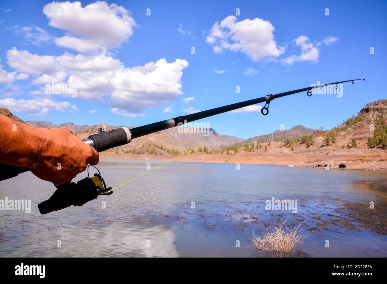 Fishing with rod on lake Stock Photo - Alamy